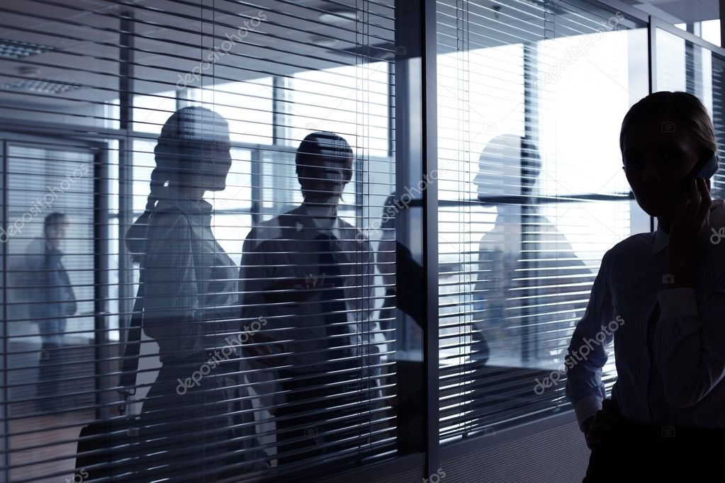 Business people communicating behind glass wall Stock Photo by ...
