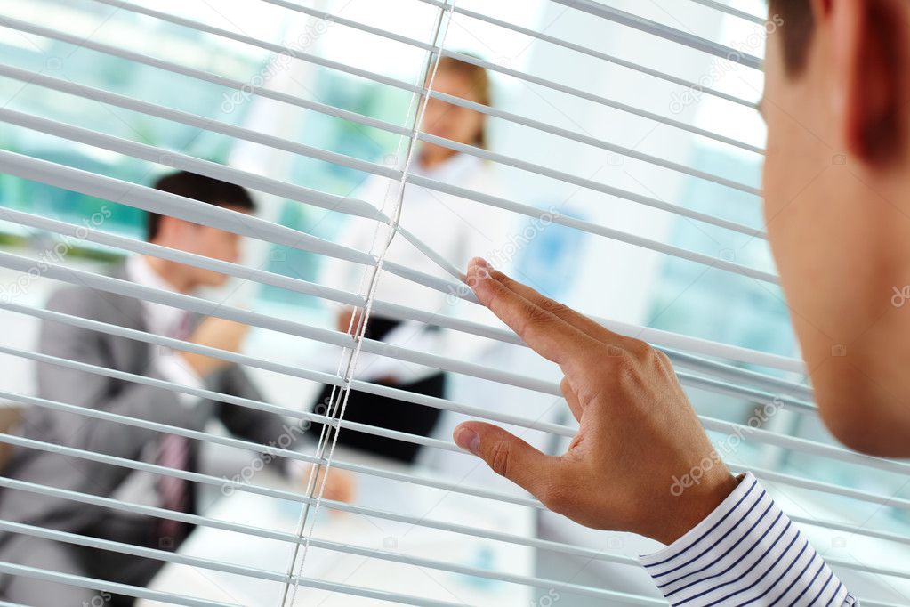 Businessman peeking for his colleagues — Stock Photo © pressmaster ... Businessman peeking for his colleagues — Stock Photo © pressmaster ...