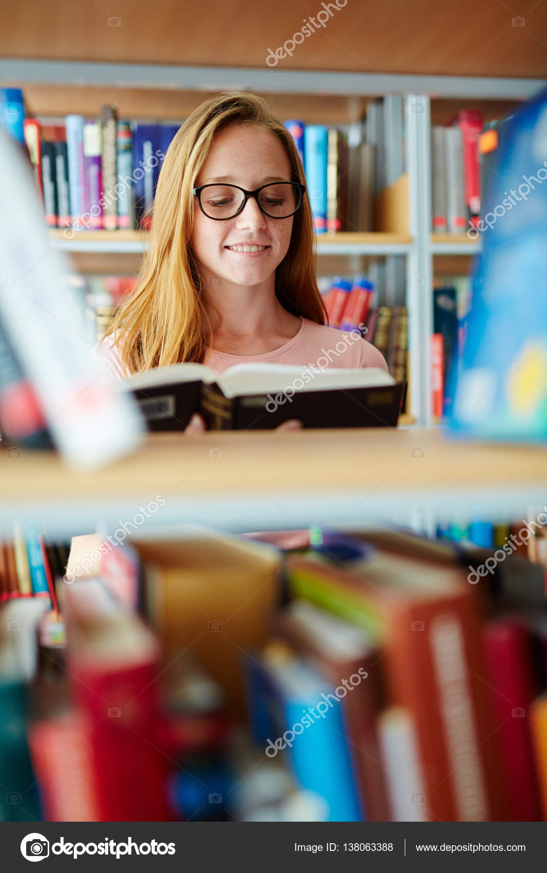 University student in library Stock Photo by ©pressmaster 138063388
