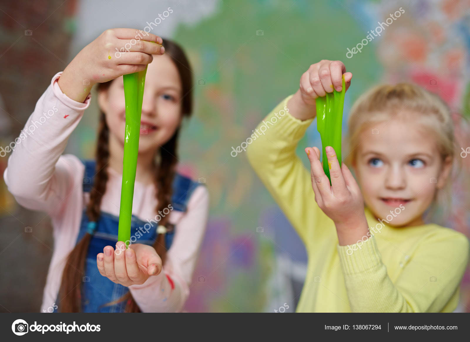 Girls playing with paint — Stock Photo © pressmaster #138067294