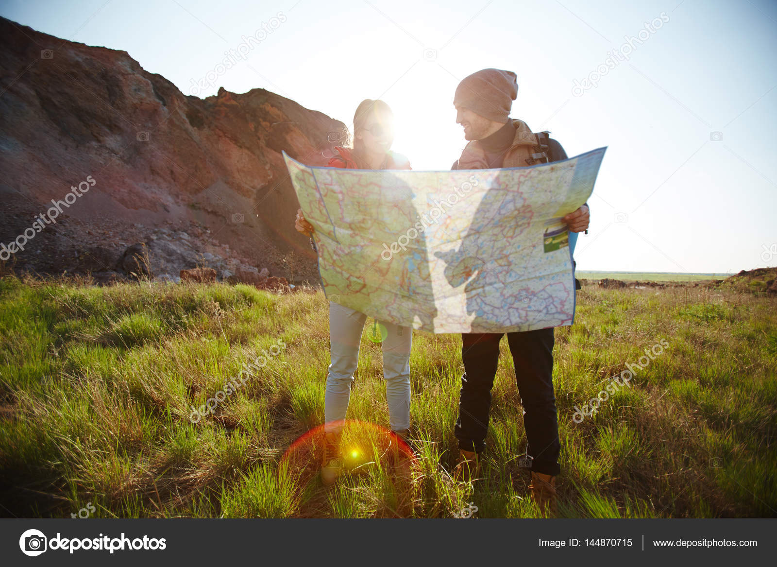 Couple holding big map — Stock Photo © pressmaster #144870715