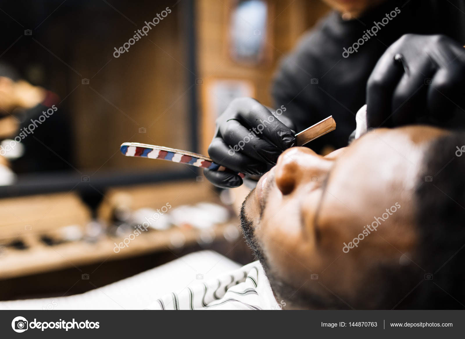 Barber shaving face of client — Stock Photo © pressmaster #144870763 Barber shaving face of client — Stock Photo © pressmaster #144870763