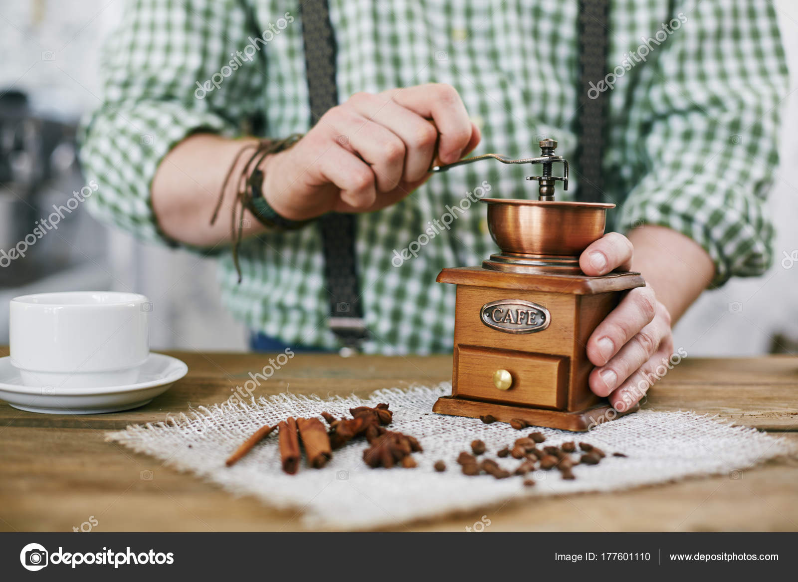 Man Grinding Coffee