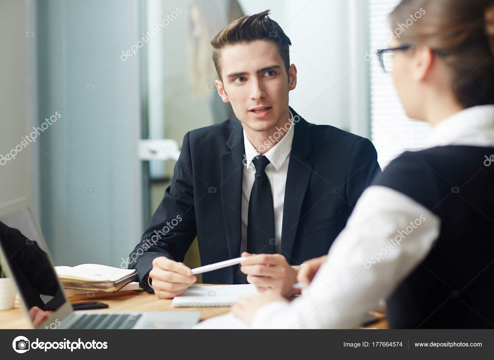 Confident Young Entrepreneur Wearing Suit Conducting Negotiations ...