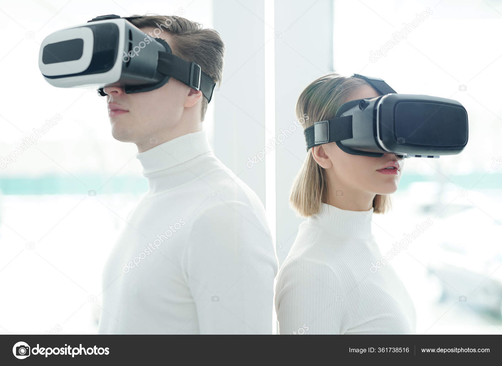 Young People White Sweaters Wearing Virtual Reality Goggles Standing ...