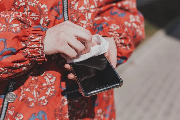 Cleaning mobile phone screen with disinfecting wet wipes for clean ...