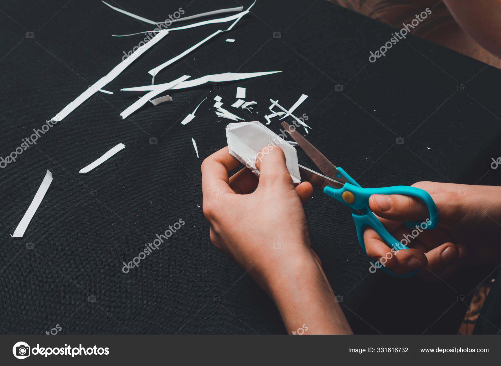 From white paper boy cuts a white square. Stock Photo by ©NIKO ...