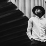 Young handsome afro black man Stock Photo by ©peus 90303780