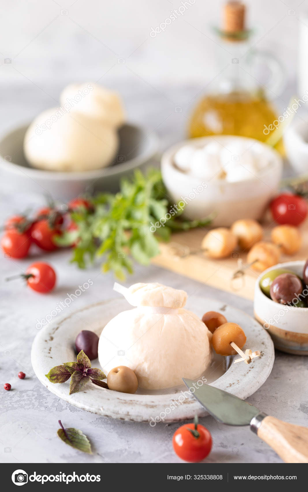 Italian cheeses burrata, mozzarella, scorocia, boccini with olives ...