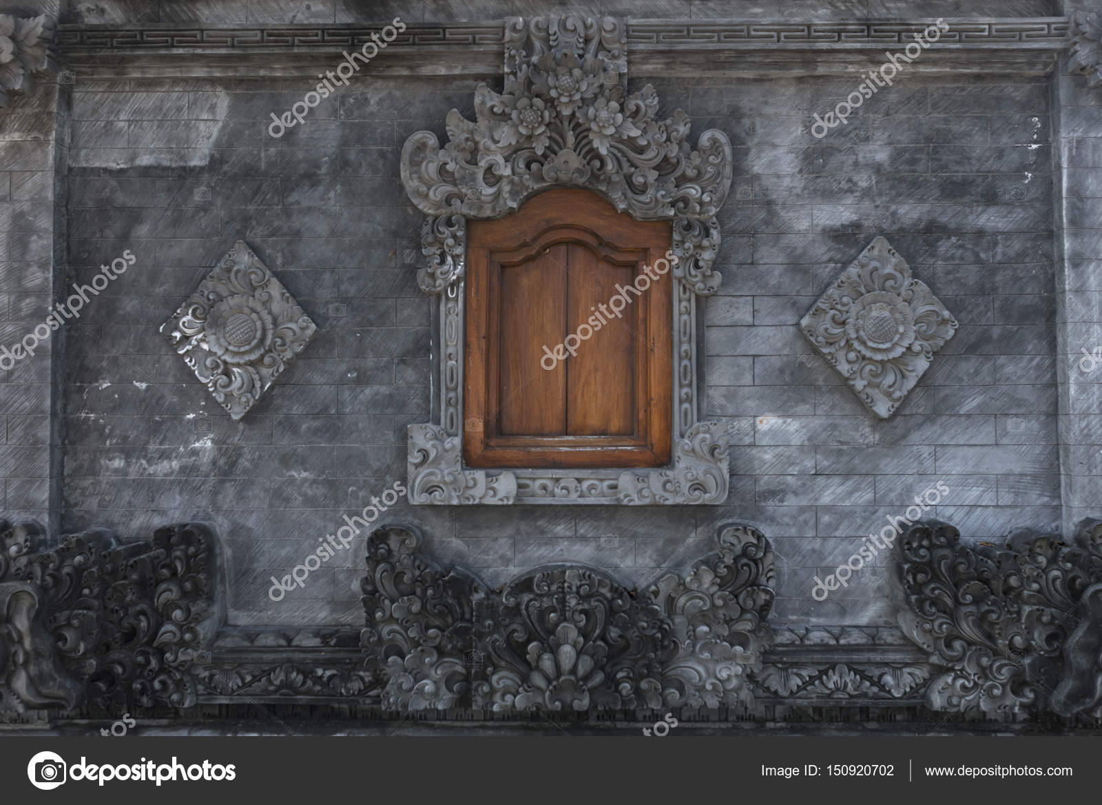 Ancient balinese temple wall. Fort castle doors or a window. Stock ...