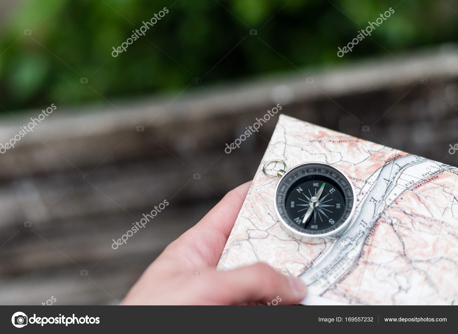 Man Holding Compass Hand Stock Photo by ©Svyatkovsky 169557232
