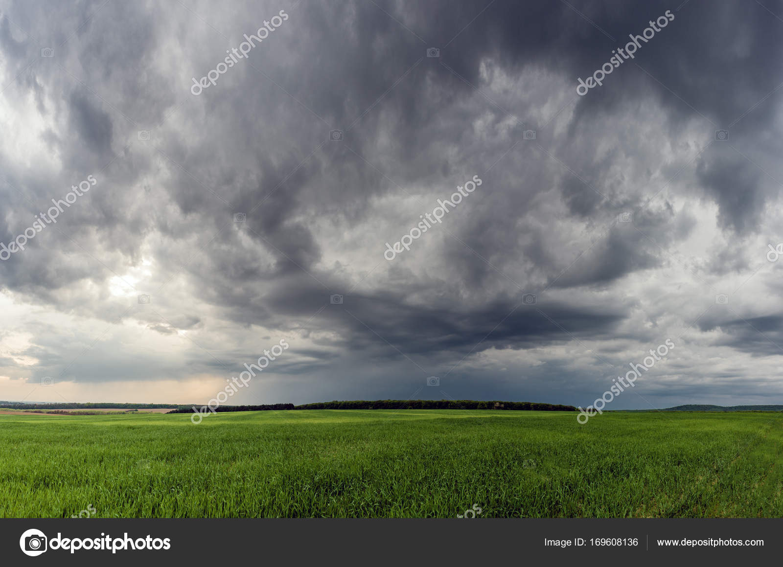 Dramatic storm scene with rain at the horizon and rural path going ...