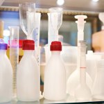 Set of empty plastic chemical bottles with straws in a lab envir Stock ...