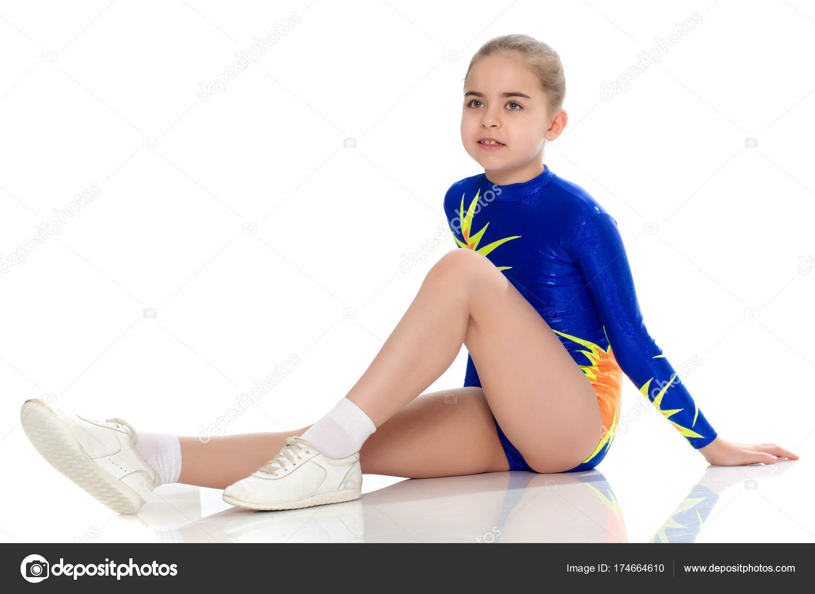 A girl gymnast performs exercises on the floor. — Stock Photo © lotosfoto1 #174664610