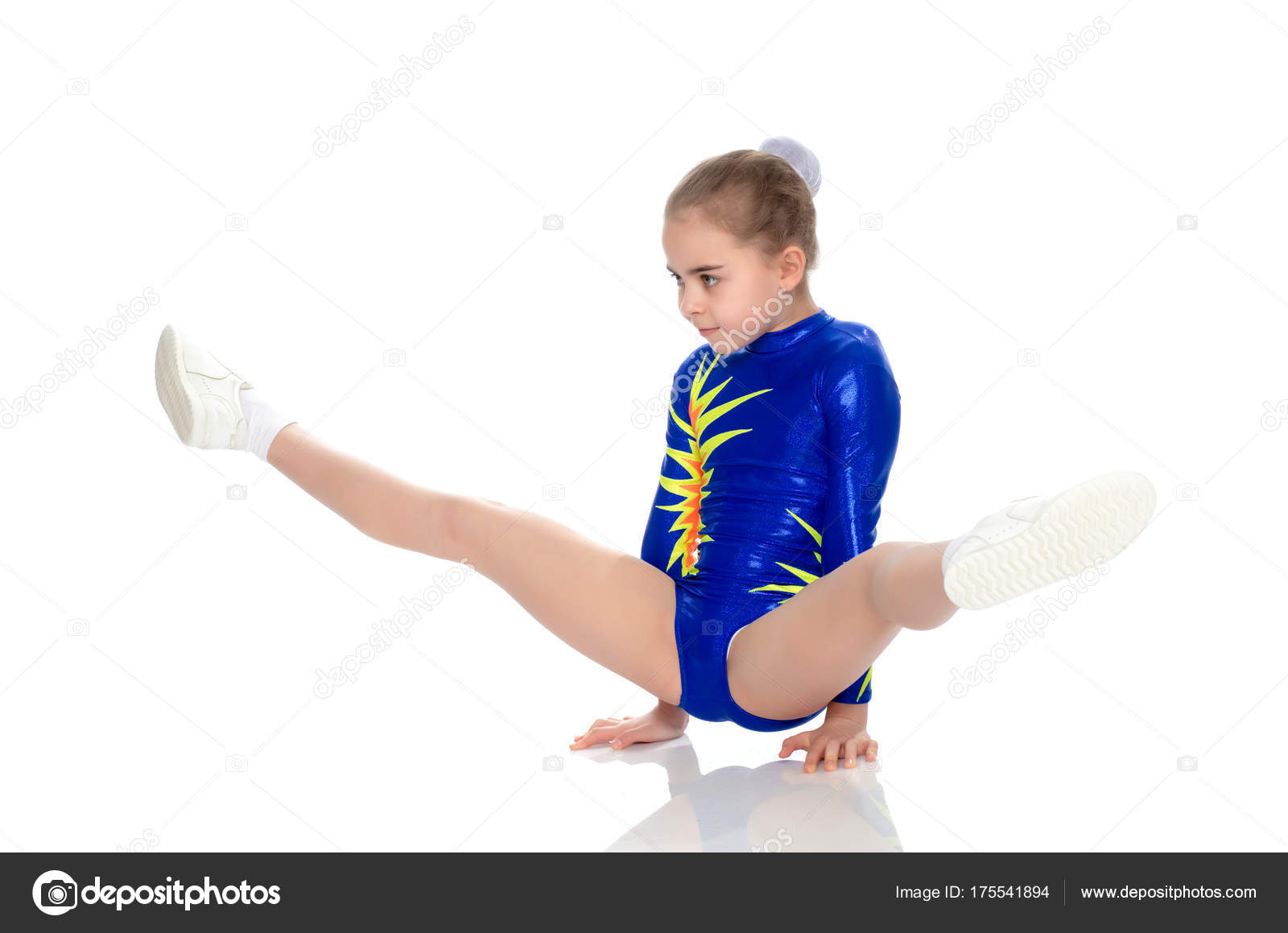 A girl gymnast performs exercises on the floor. — Stock Photo © lotosfoto1 #175541894