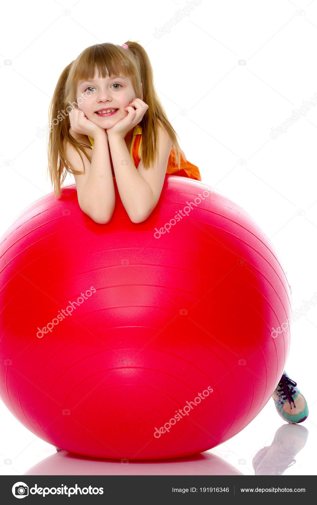 Little girl doing exercises on a big ball for fitness. Stock Photo by ...