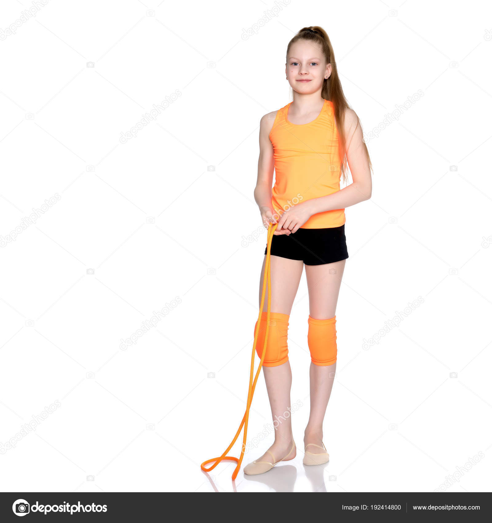 A girl gymnast performs exercises with a skipping rope. Stock Photo by ...