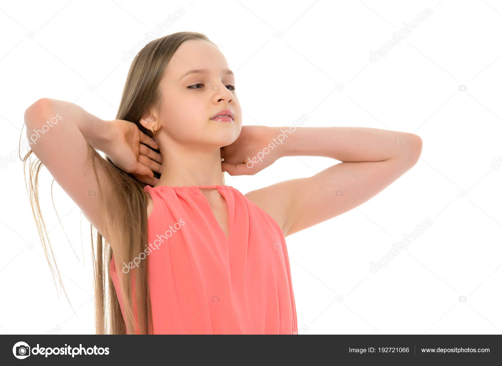 A little girl fixes her hair. Stock Photo by ©lotosfoto1 192721066