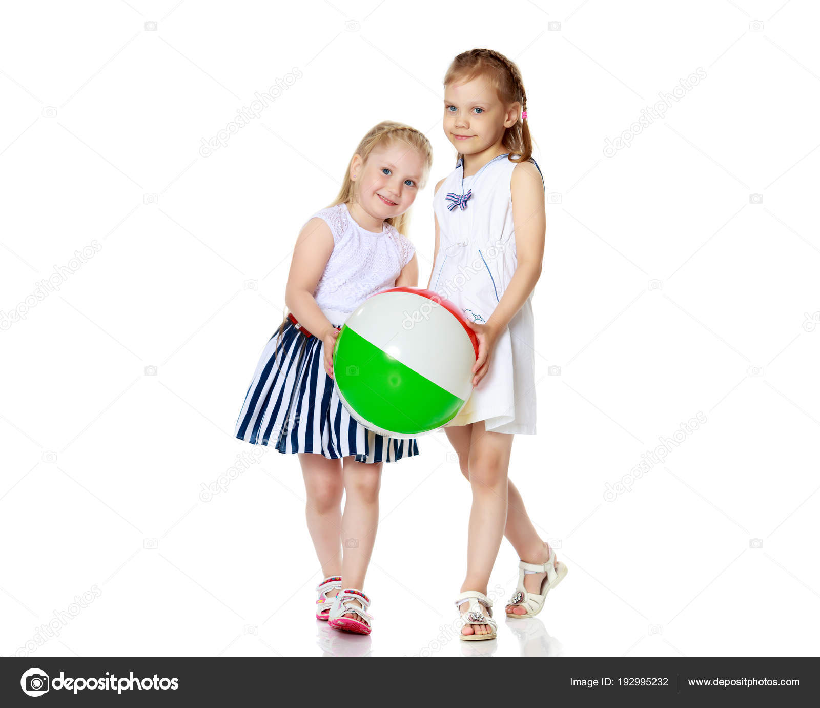Two little girls play ball. — Stock Photo © lotosfoto1 #192995232