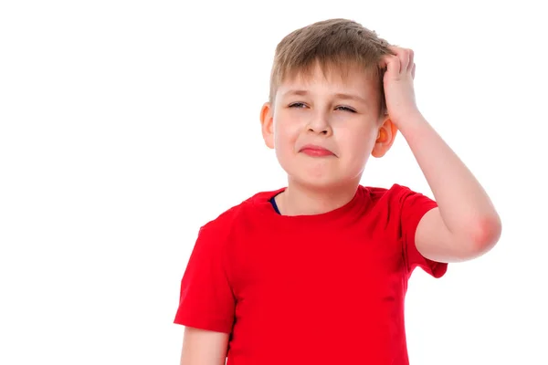 Disappointed little school-age boy. Stock Photo by ©lotosfoto1 191915292