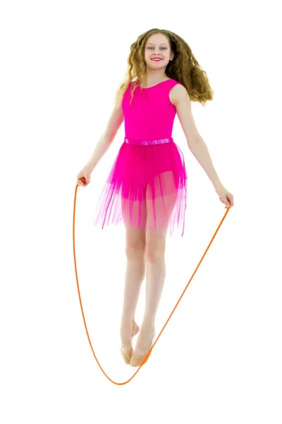 A girl gymnast performs exercises with a skipping rope. Stock Photo by ...