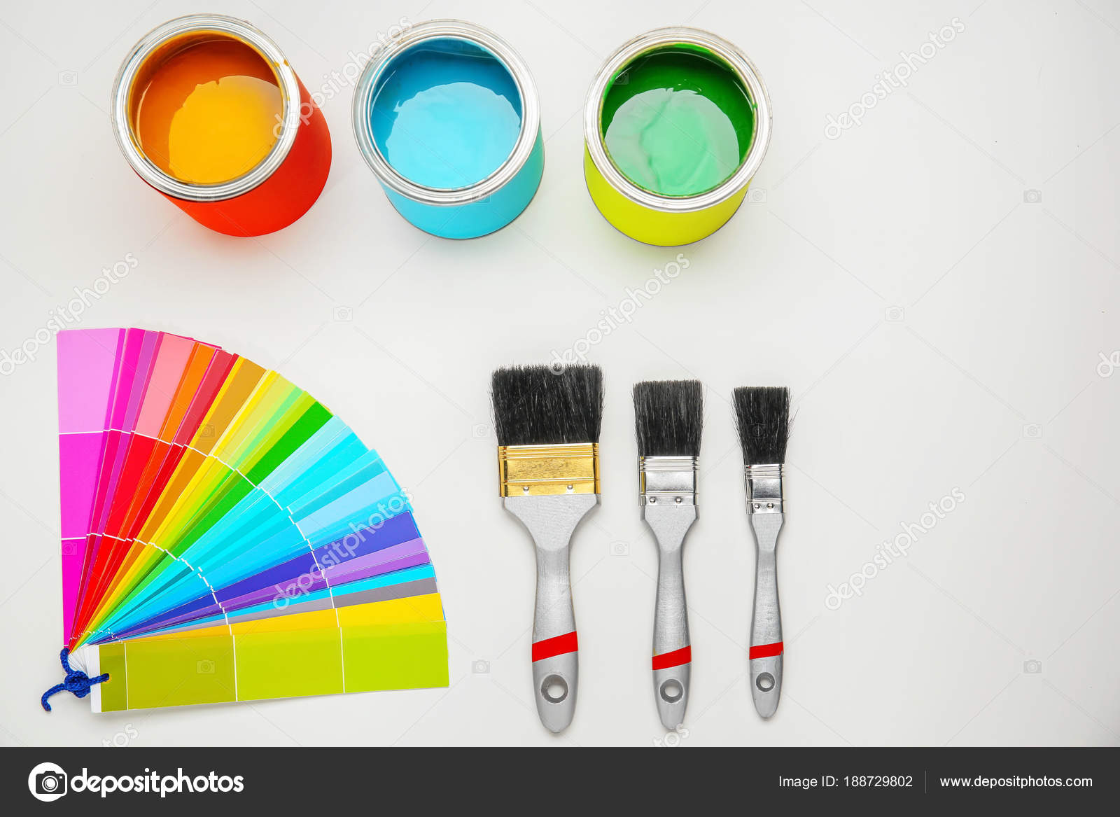 Paint cans, brushes and color palette samples on light background ...