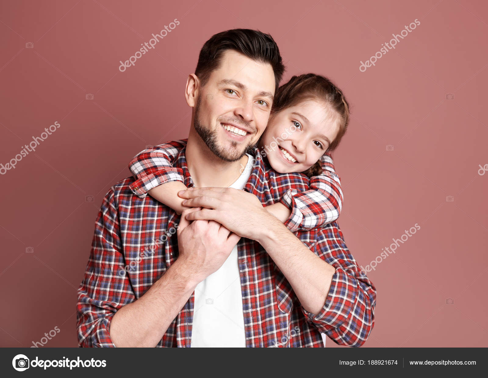Dad and his daughter hugging on color background. Father's day ...