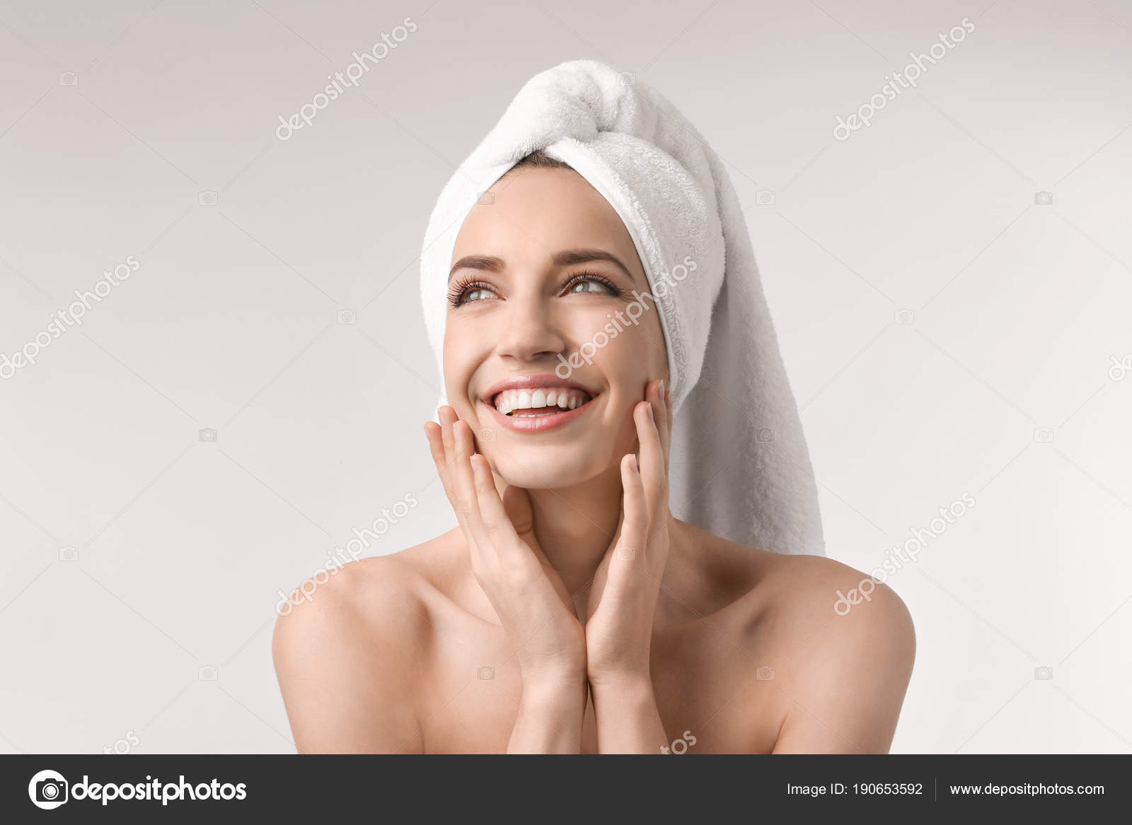 Beautiful young woman with silky skin on light background Stock Photo ...