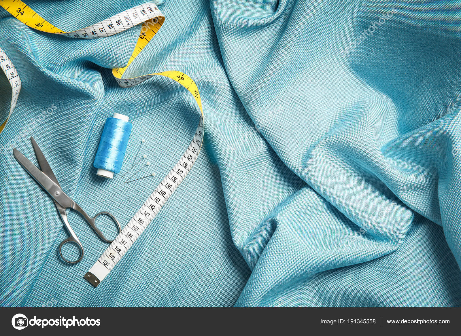 Measuring tape, scissors and thread on fabric. Tailoring tools Stock ...