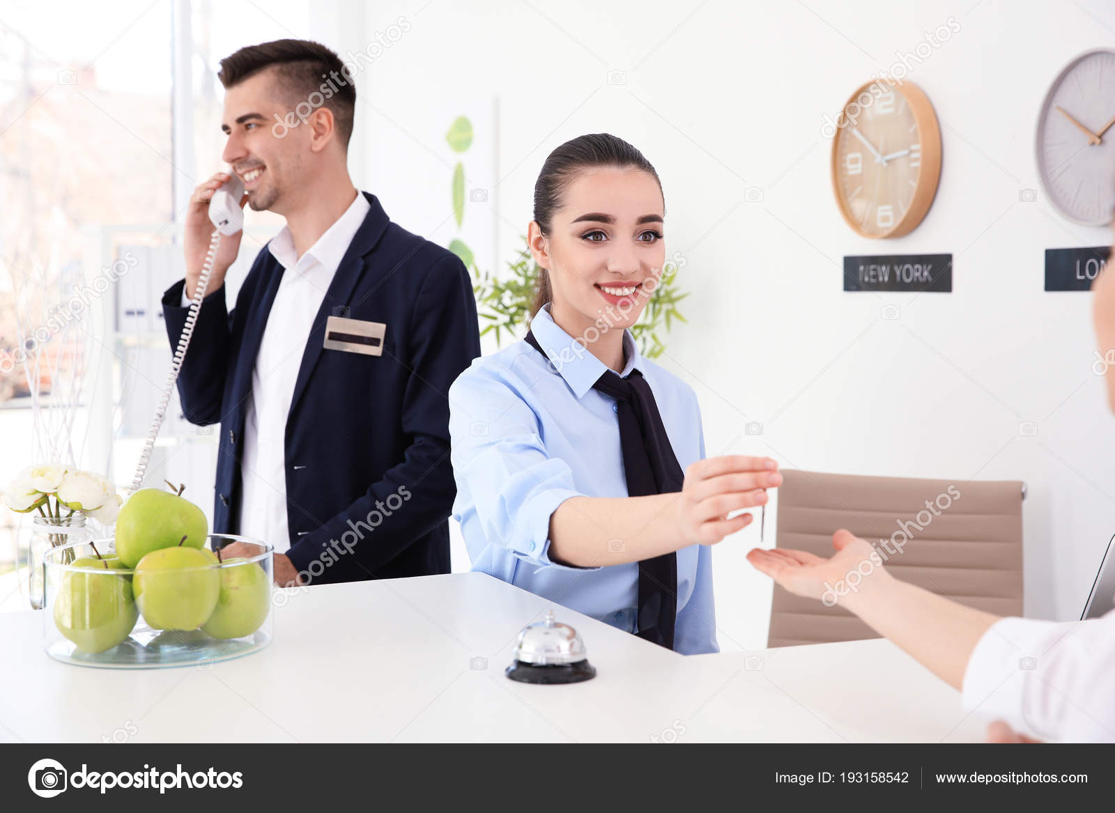 Busy receptionists at workplace in hotel — Stock Photo © NewAfrica ...