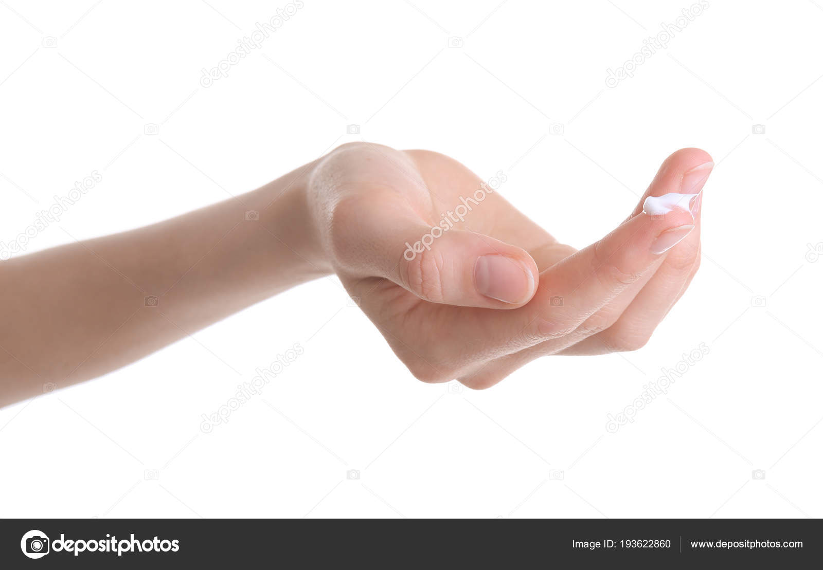 Young woman applying hand cream against on white background Stock Photo ...