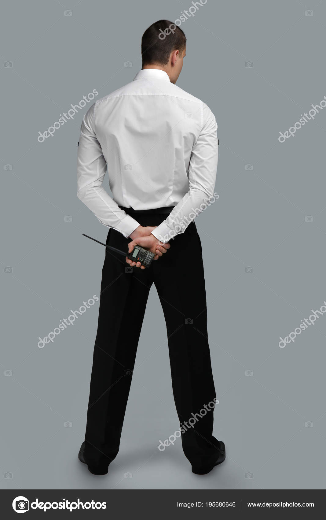 Male security guard in uniform on color background Stock Photo by ...
