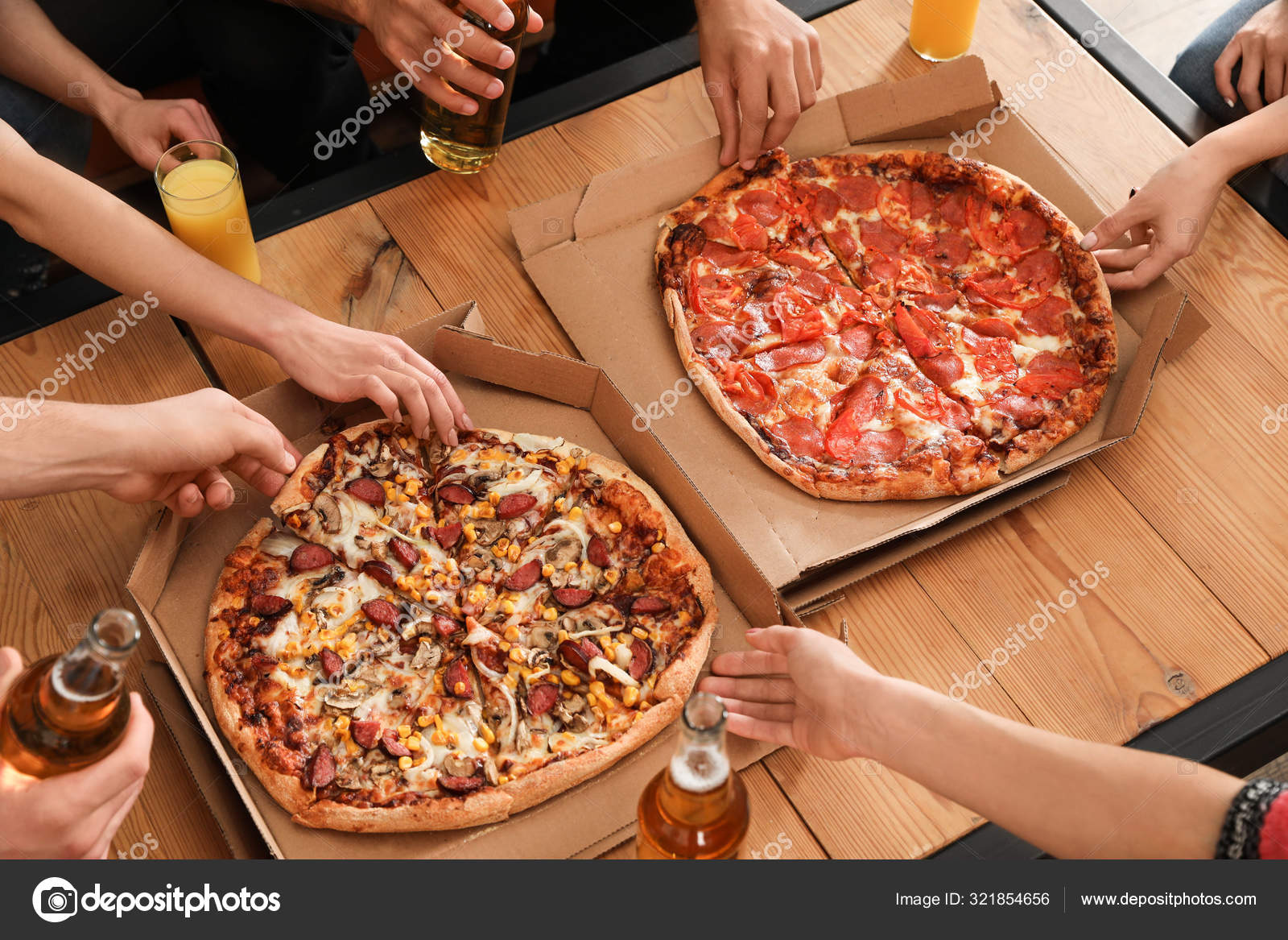 Young People Eating Delicious Pizza Table Closeup Stock Photo by ...