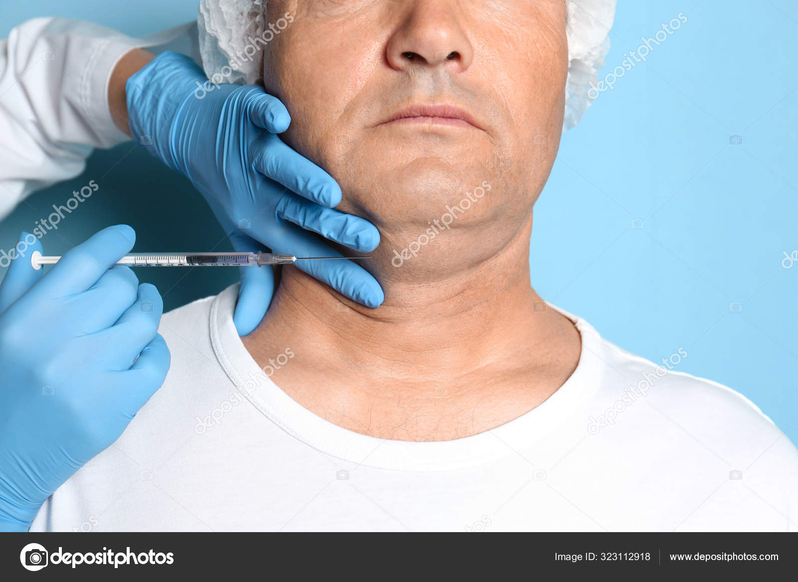 Mature man with double chin receiving injection on blue backgrou Stock ...