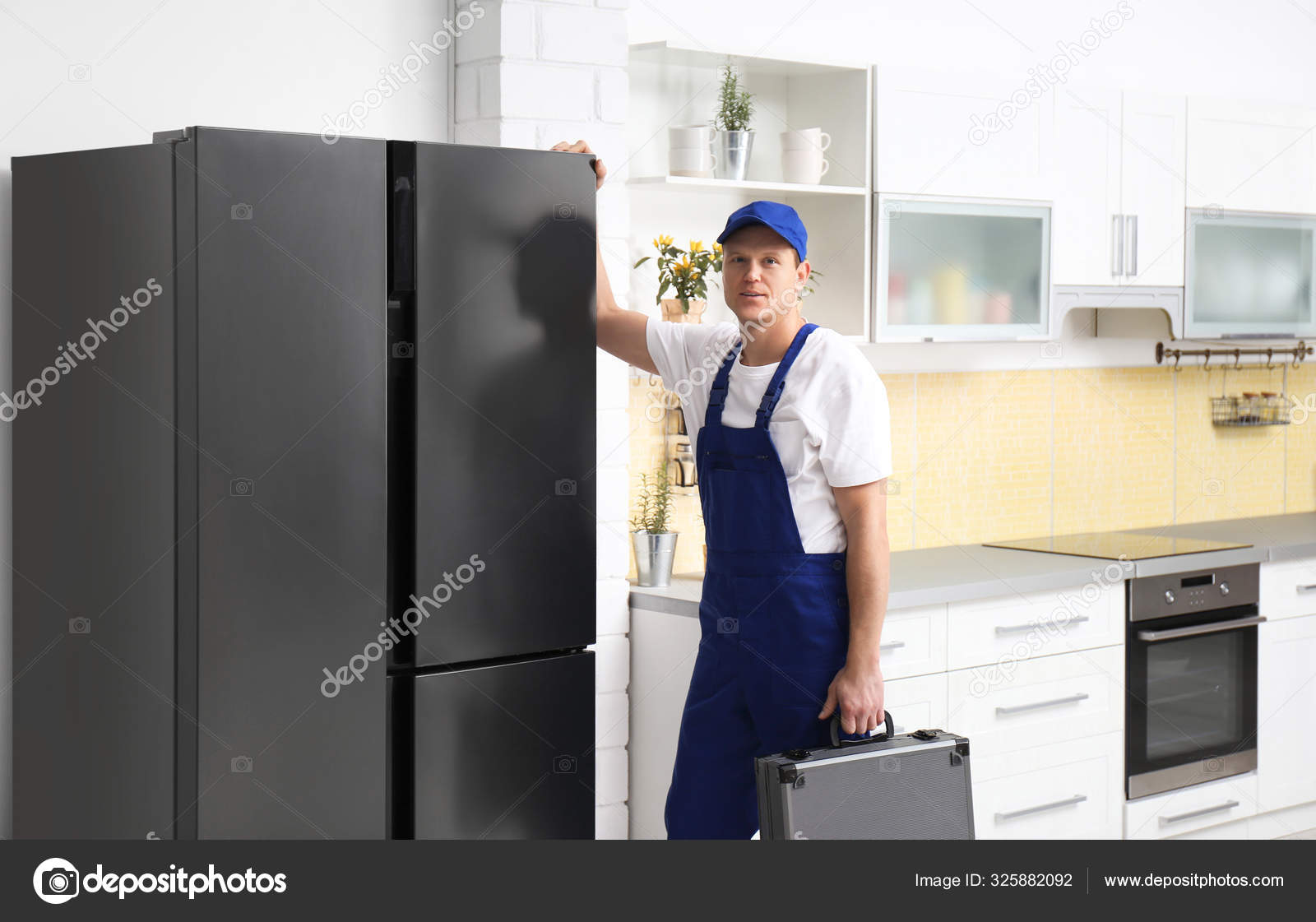 Male Technician Tool Box Refrigerator Kitchen Stock Photo by ©NewAfrica ...