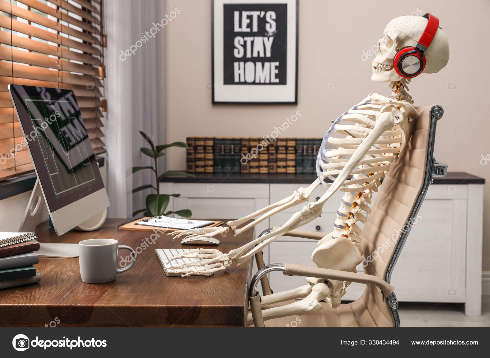 Human Skeleton Headphones Using Computer Workplace Stock Photo by ...