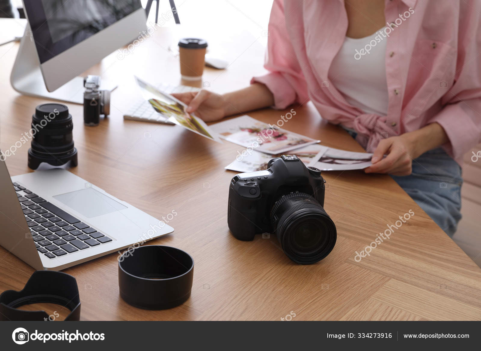 Professional photographer working at table in office, closeup Stock ...