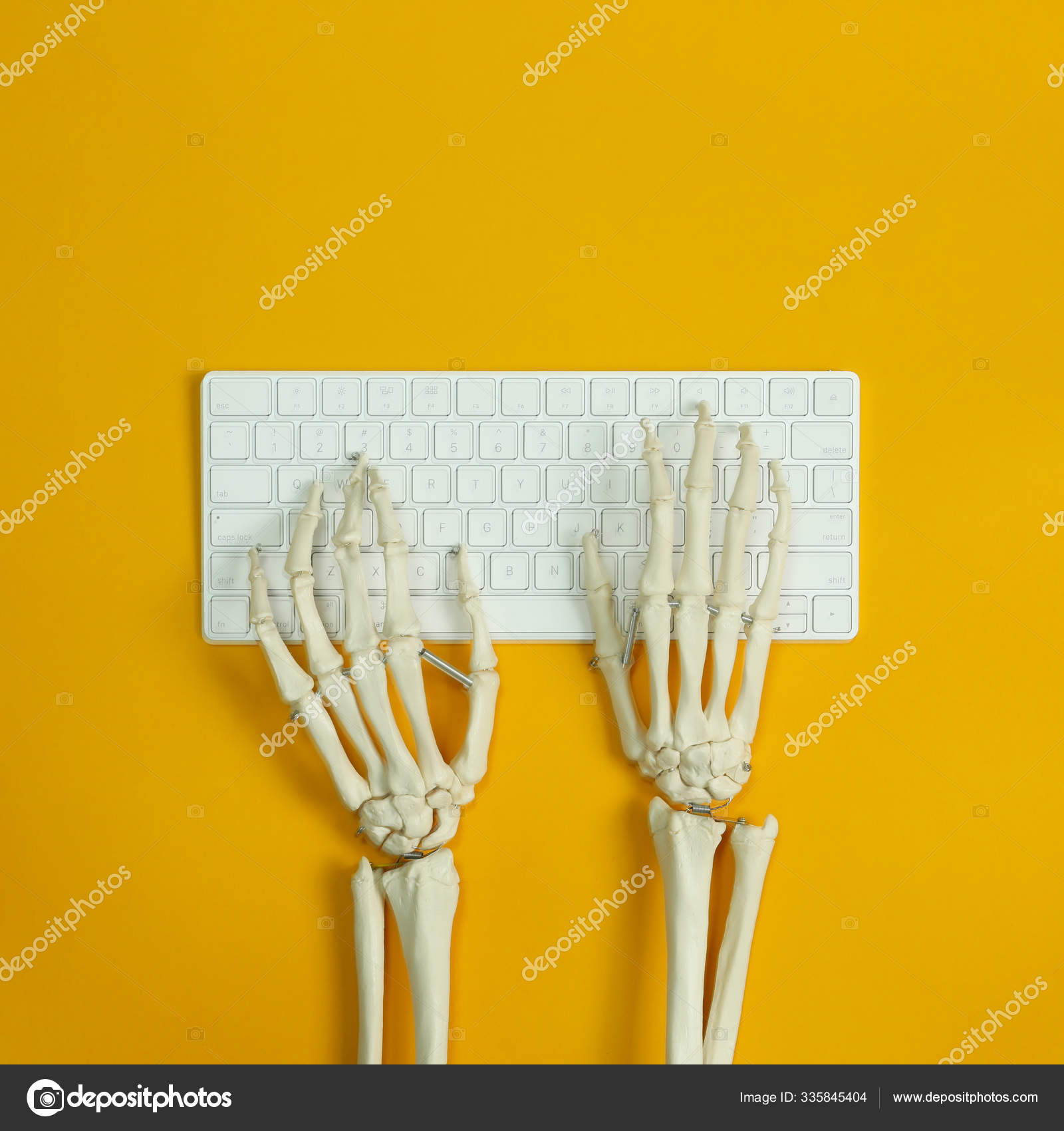 Human Skeleton Using Computer Keyboard Yellow Background Top View ...