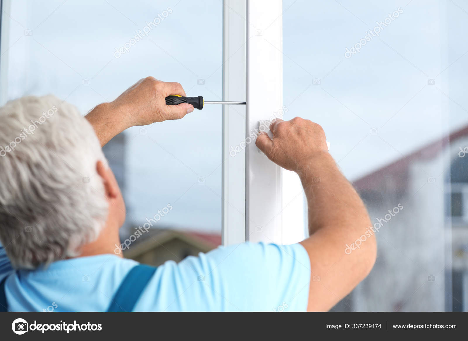 Mature Construction Worker Repairing Plastic Window Screwdriver Indoors ...