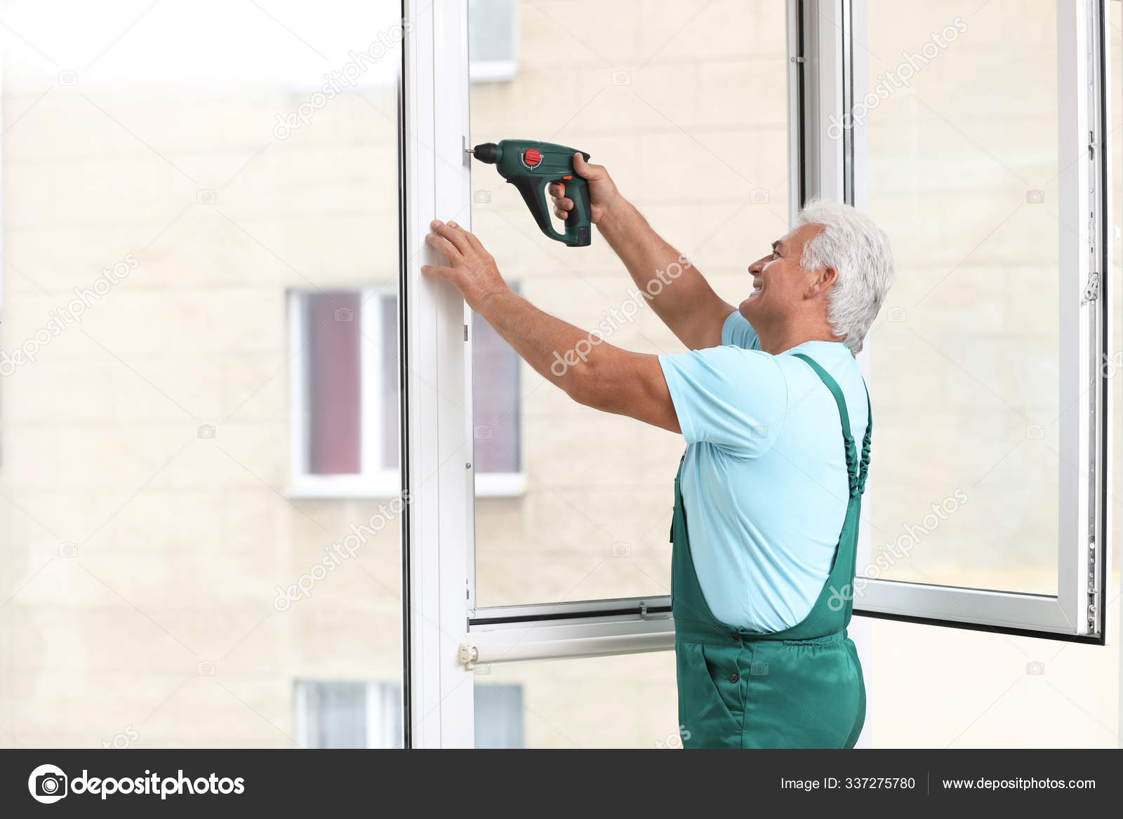 Mature Construction Worker Repairing Plastic Window Electric ...