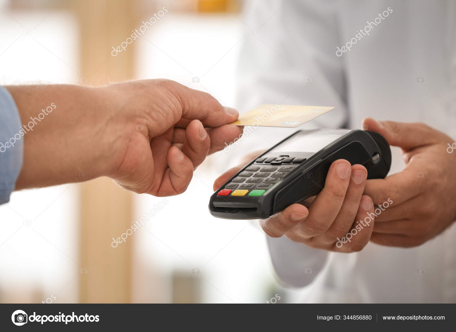 Customer using terminal for contactless payment with credit card Stock ...
