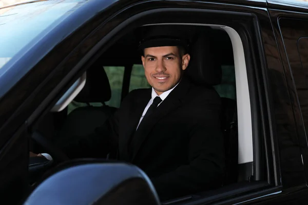 Professional driver in luxury car. Chauffeur service - Stock Image ...