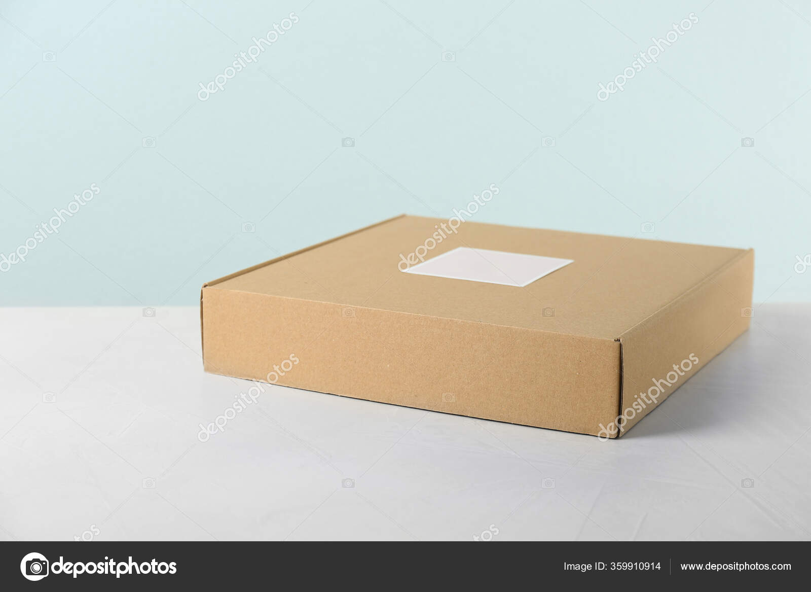Cardboard Box Table Light Background Stock Photo by ©NewAfrica 359910914