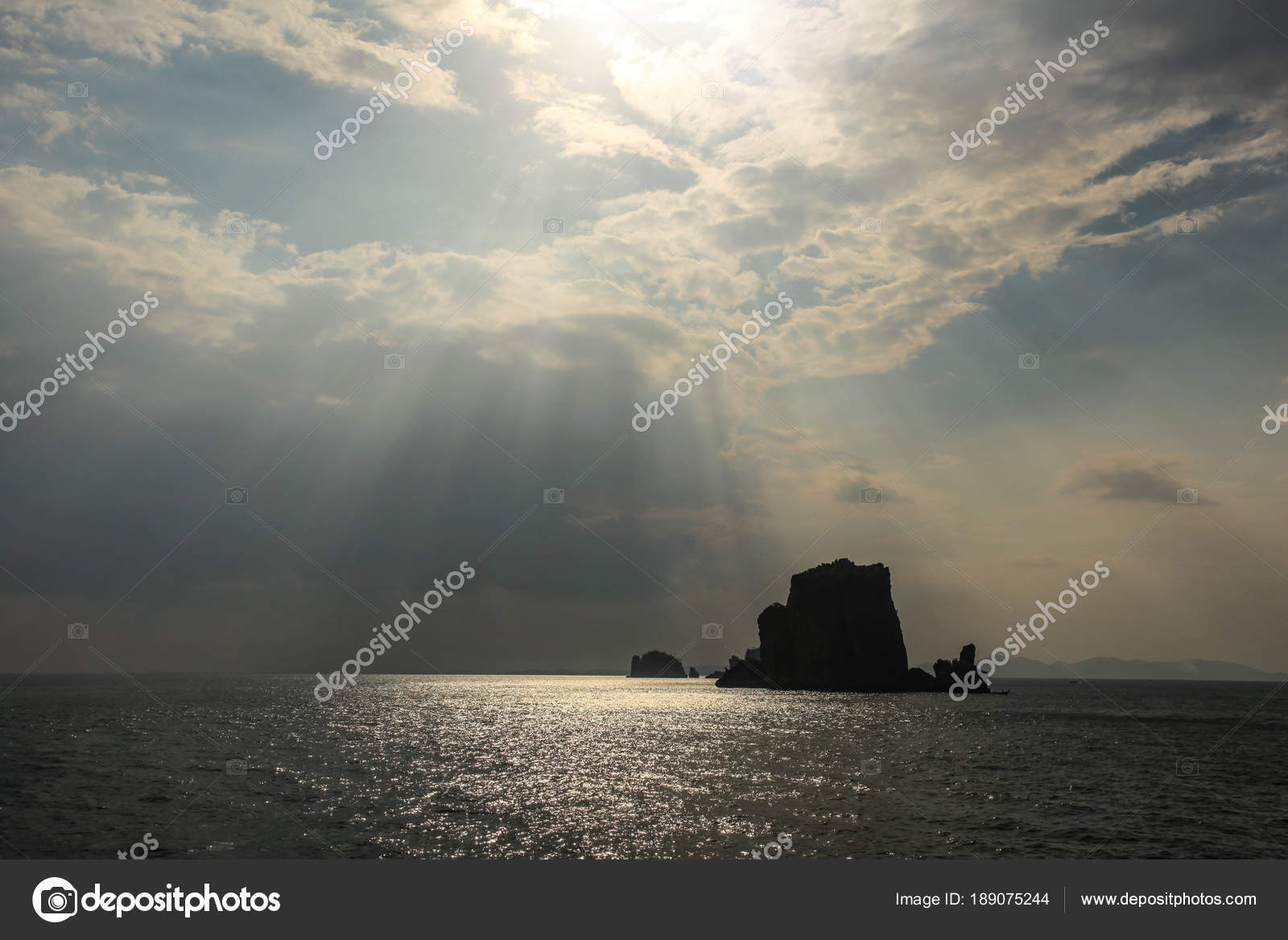 Sun rays shining on small deserted island in Andaman sea Stock Photo by ...