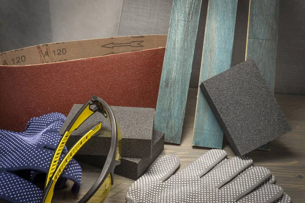 Various grinding tools - sanding belt, abrasive sponge and flap disc ...