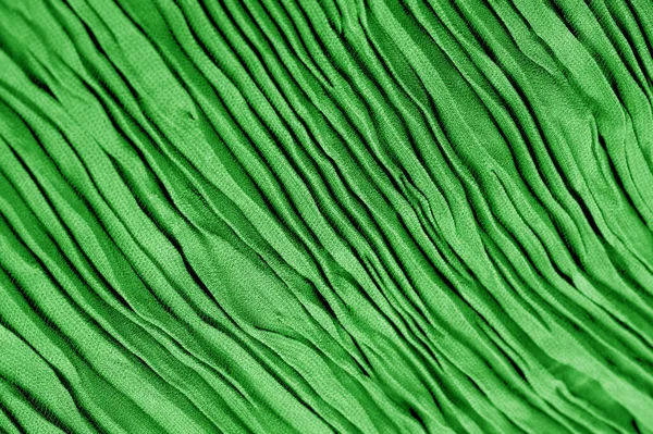 Green pleated fabric texture. — Stock Photo © natalt #127003414