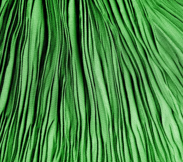 Green pleated fabric texture. — Stock Photo © natalt #127003414