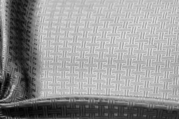 Background texture, pattern. Black silk fabric with a small chec ...