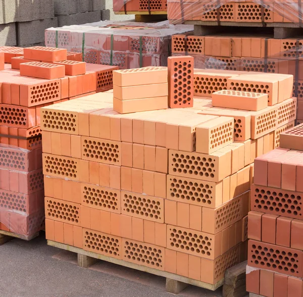 Wall ceramic perforated blocks of red bricks on a pallet Stock Photo by ...