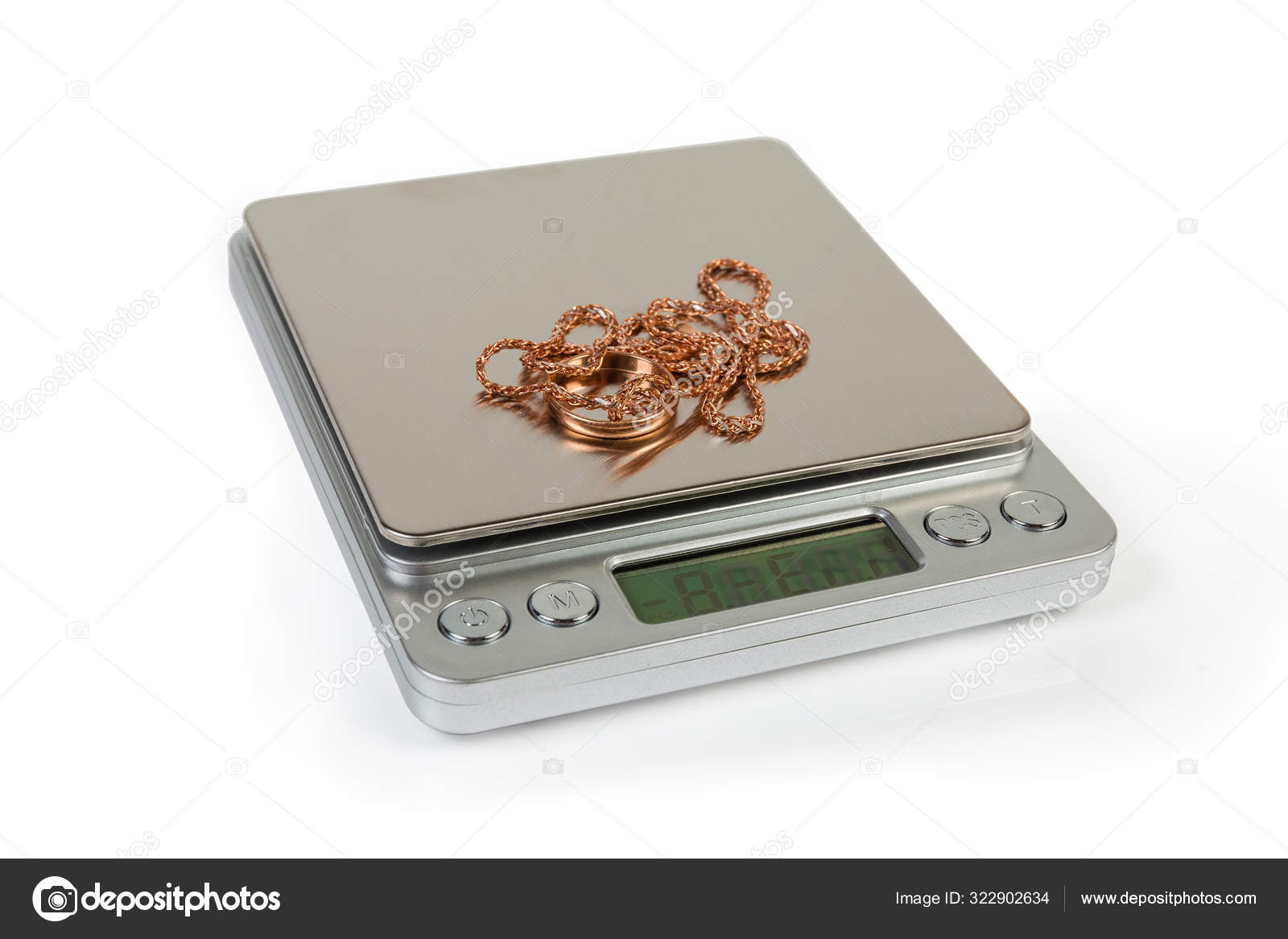 Professional digital table scales and gold jewelry on them close-up ...
